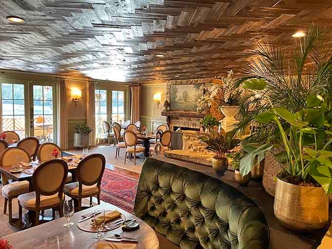 That reclaimed wood ceiling and tufted velvet seating create an atmosphere fancier than your living room but just as welcoming.