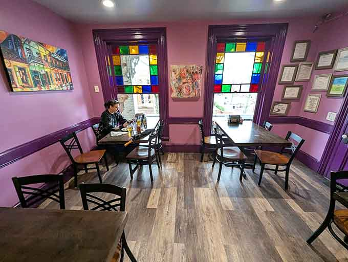 Purple walls and stained glass windows create an atmosphere that's equal parts jazz club and mountain retreat.