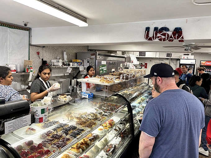 Behind that counter, magic happens while customers wait patiently for their turn at Italian pastry heaven.