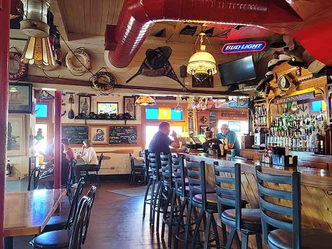 Nautical treasures hang overhead like a maritime museum designed by someone who actually loves the water.