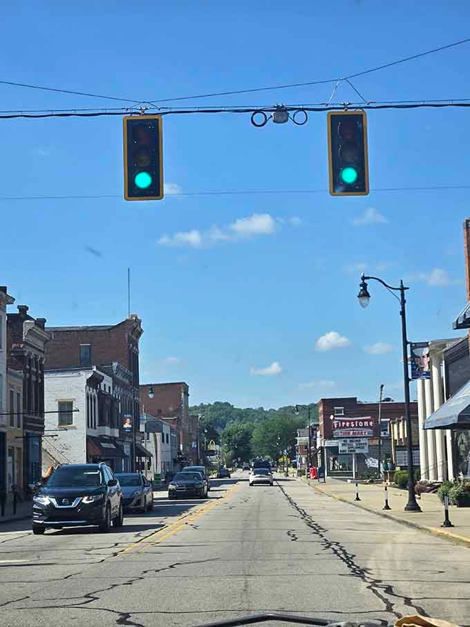 Those hanging traffic lights have seen more history than most museums, swaying gently over generations of passersby.