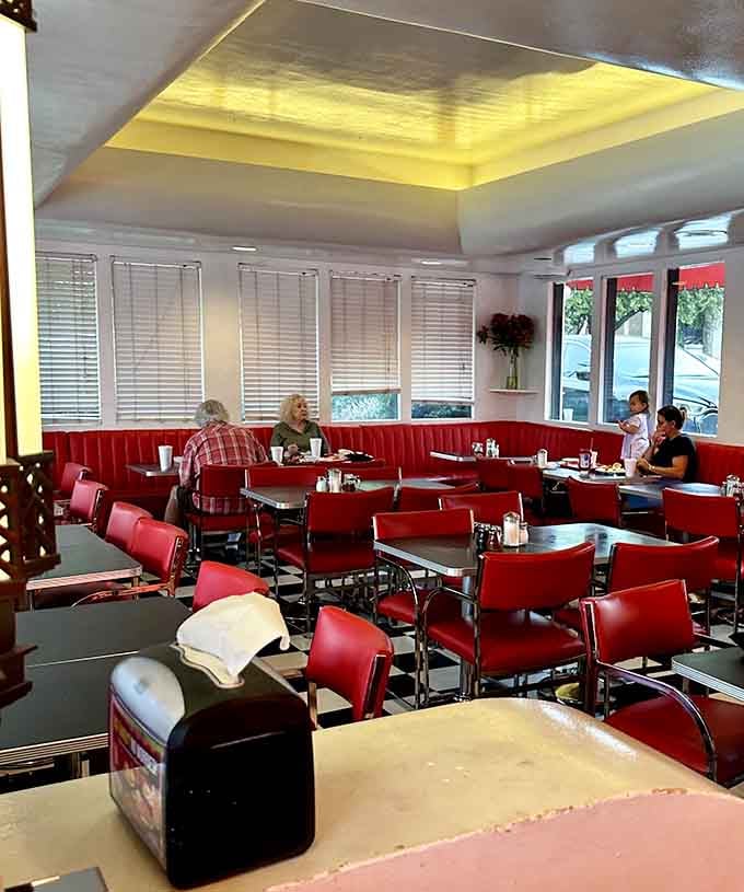 Red vinyl booths and checkered floors create the perfect time capsule where comfort food reigns supreme.