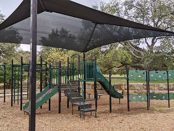 Modern playground equipment meets thoughtful shade design, because nobody should have to choose between fun and sunburn prevention.