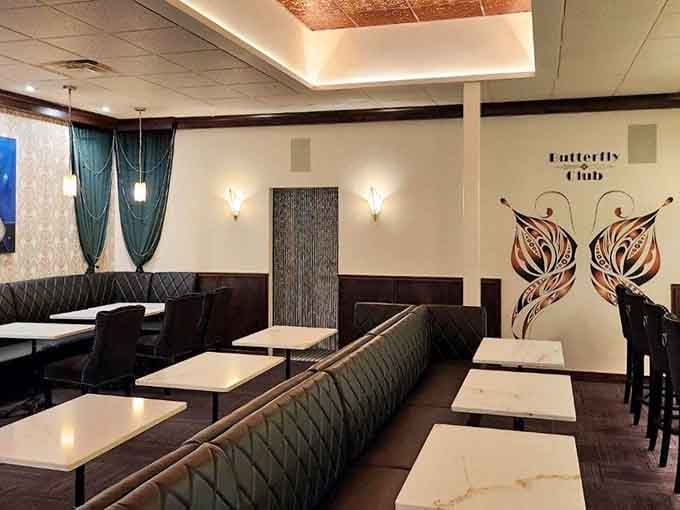 The emerald green booths and Art Deco touches create an atmosphere that's equal parts Gatsby party and modern sophistication.