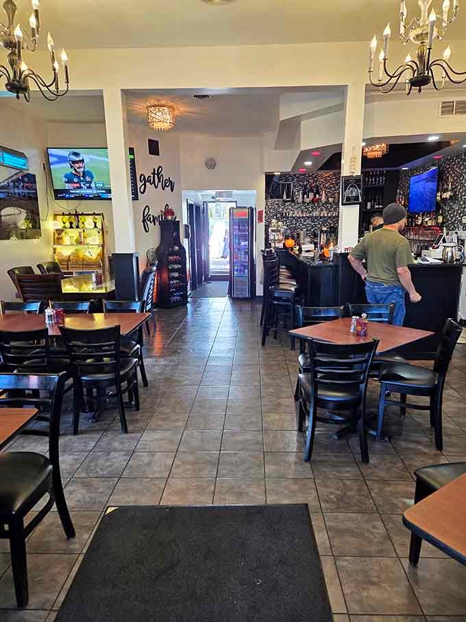 Chandeliers meet sports TVs in this welcoming space where elegance shakes hands with comfort like old friends reuniting.