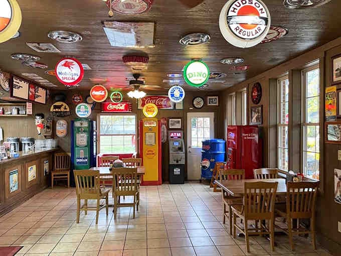 When vintage gas station signs meet comfort food heaven, you get an interior that's basically a hug for your eyes.