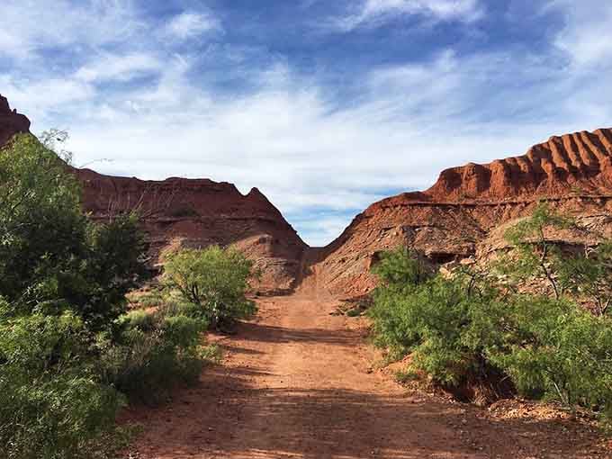 Red rock walls frame this trail like nature's own cathedral, minus the pews and collection plate.