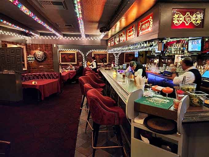 Red leather booths and twinkling lights create the kind of atmosphere where deals get made and memories get born.