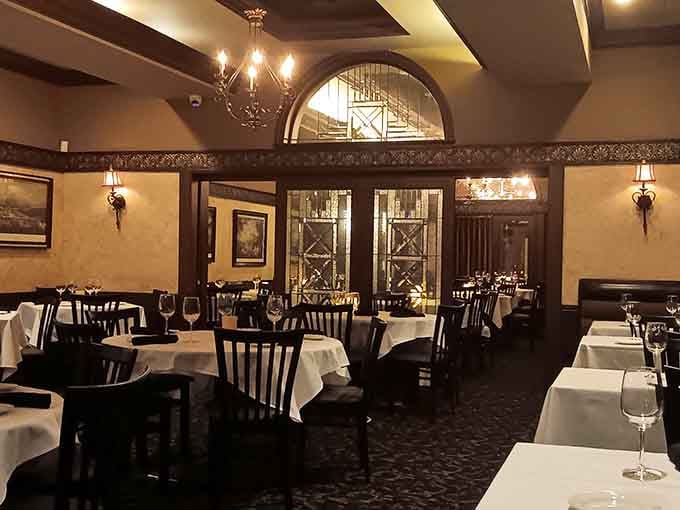 White tablecloths and warm lighting create the kind of atmosphere where time slows down and conversations actually happen.