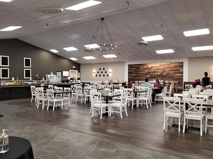 Clean lines, warm wood, and white chairs create an inviting space that's cafeteria meets country chic.