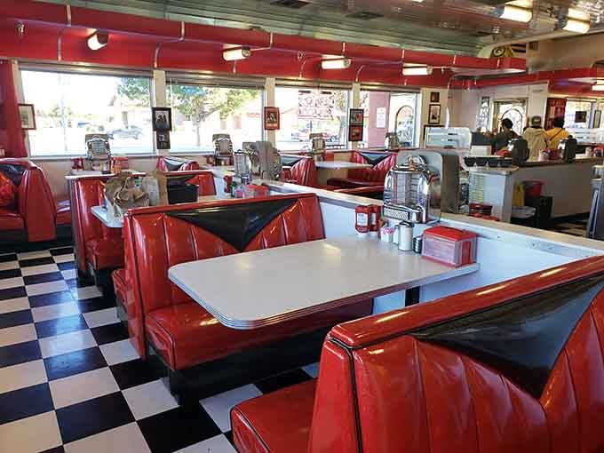 Red vinyl booths and checkered floors create the perfect time machine back to breakfast's golden era.