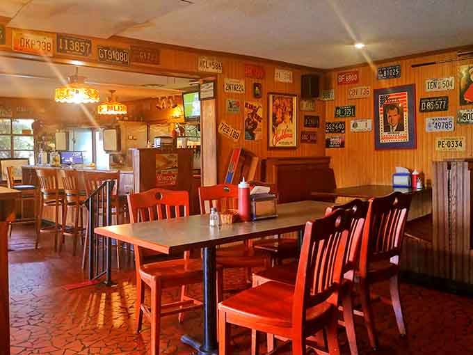 License plates from across America line the walls like postcards from satisfied customers who never left.