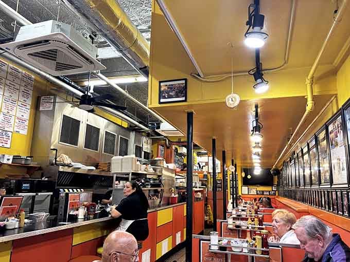 Yellow walls, orange booths, and enough celebrity photos to fill a Hollywood museum make this diner unforgettable.