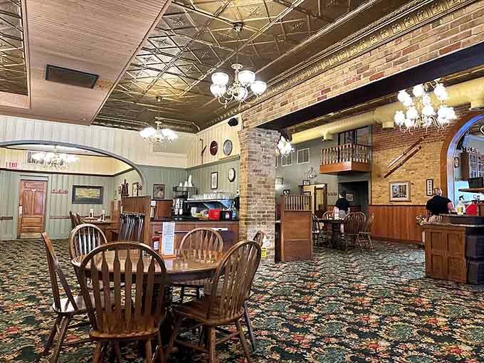 That pressed tin ceiling has witnessed more happy meals than your grandmother's dining room, and that's saying something.