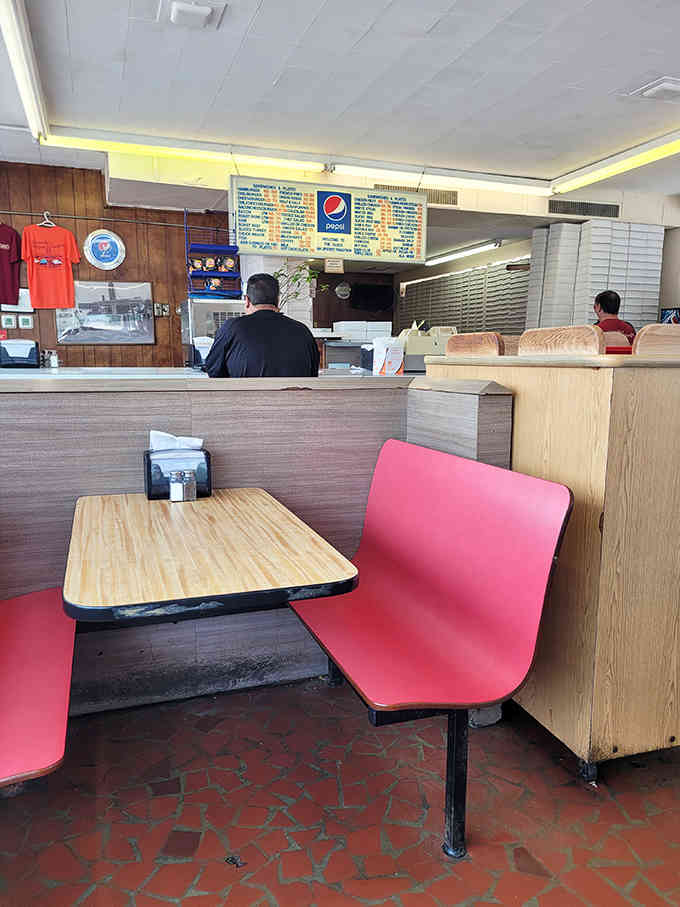 Retro booths and vintage vibes create the perfect setting for serious burger consumption and family memories.