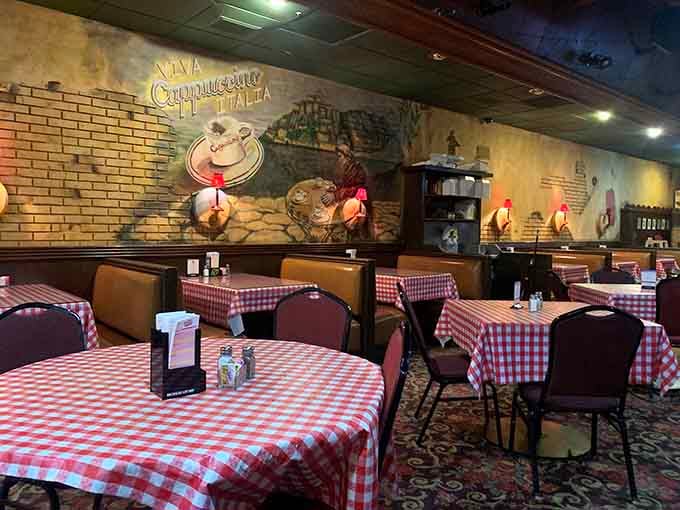 Red-and-white checkered tablecloths and vintage charm create the perfect setting for serious pizza appreciation and family memories.