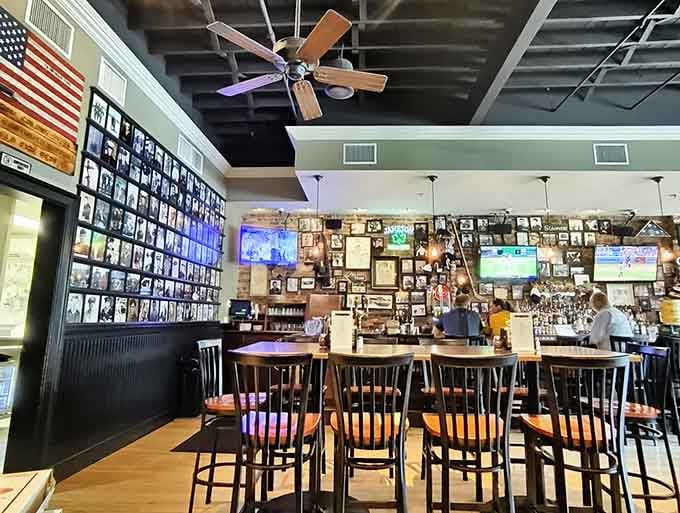 Exposed brick, vintage photos, and ceiling fans create the perfect neighborhood hangout vibe for pizza lovers.