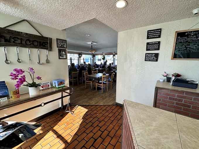 Fresh orchids by the entrance and chalkboard specials signal a place where someone genuinely cares about your experience.