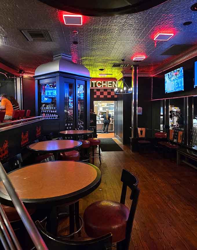 Neon lights and industrial chic create an atmosphere that's part nightclub, part seafood paradise, all fun.