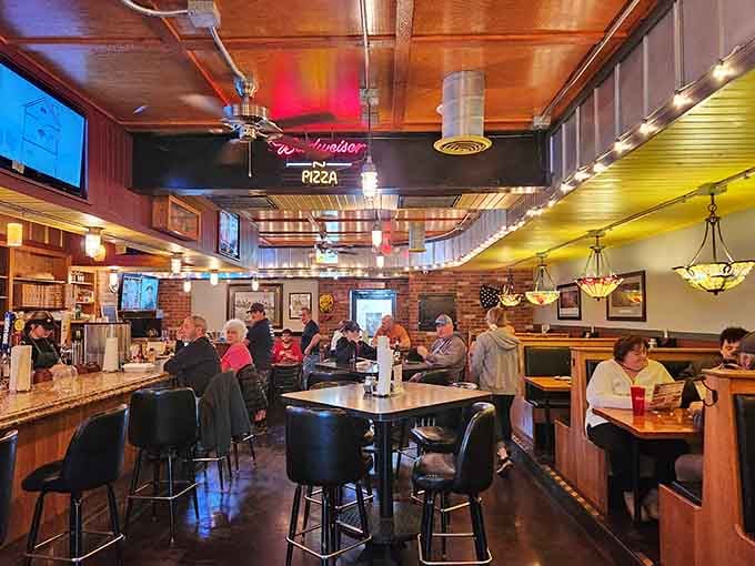 Warm lighting and comfortable seating create the perfect backdrop for serious pizza appreciation and good conversation.