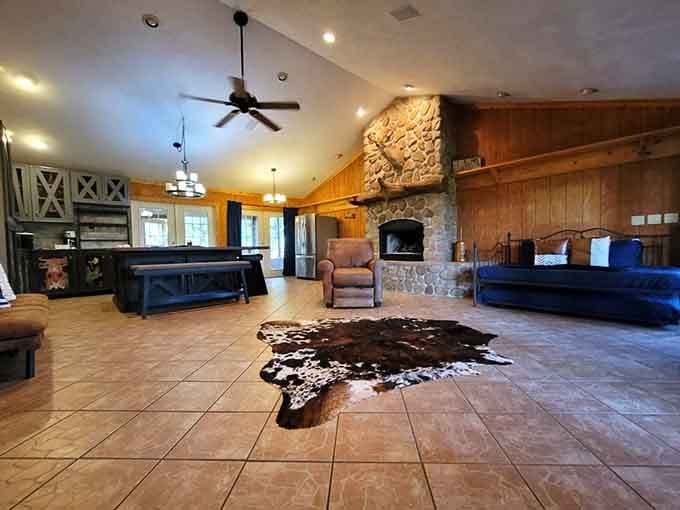 Rustic meets refined in this spacious interior where cowhide rugs and stone fireplaces create instant vacation vibes.