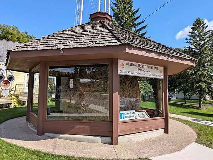 The gazebo stands proud on a perfect summer day, protecting Minnesota's most beloved sphere of agricultural twine.