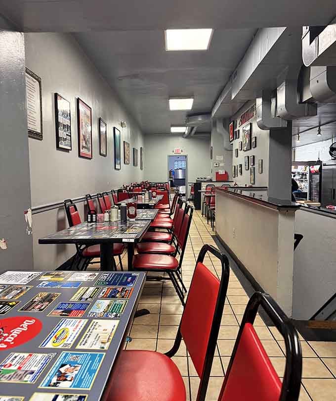 Classic diner seating where countless breakfast dreams have come true, one red vinyl booth at a time.