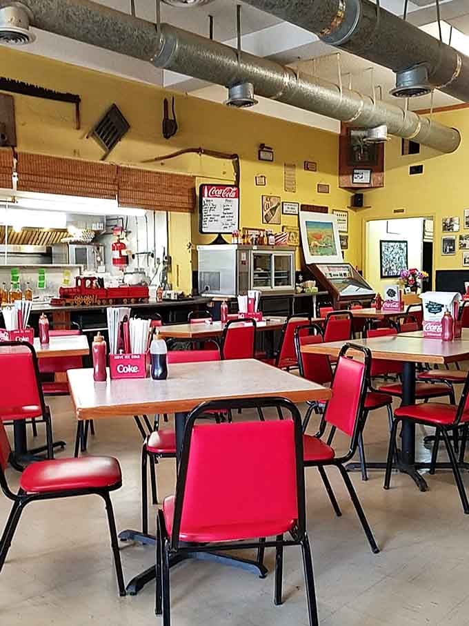 Yellow walls and red chairs create the kind of cheerful atmosphere that makes everything taste better somehow.