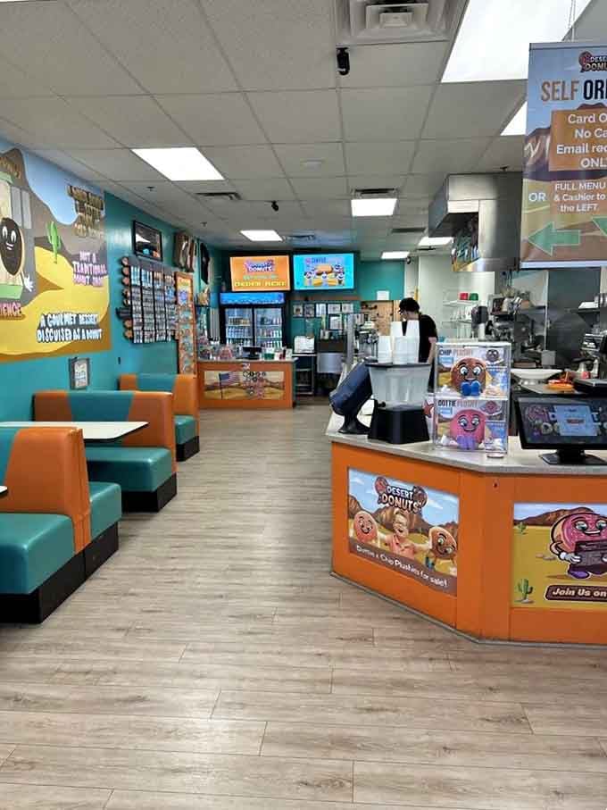 That turquoise and orange color scheme isn't just cheerful—it's strategically designed to make you forget you came for just one donut.