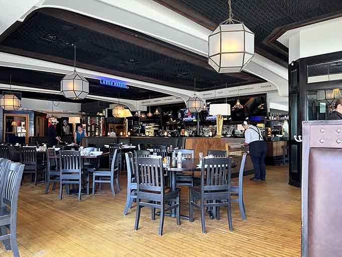 Clean lines, warm wood, and that gorgeous bar create an atmosphere where casual meets classy without trying too hard.