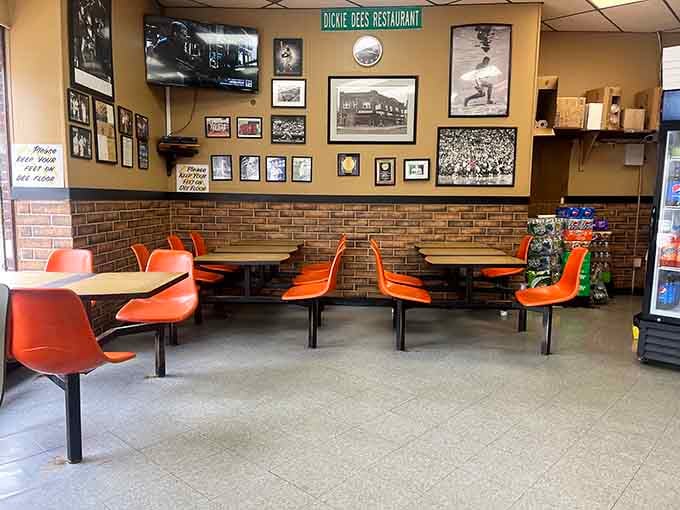 Orange chairs and vintage photos create a time capsule where the only thing that matters is good food.