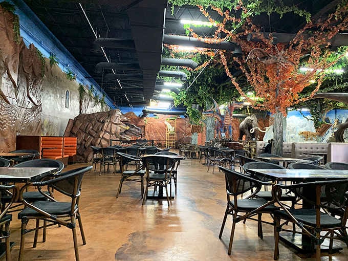 Inside, towering trees and ancient creatures create a jungle atmosphere that makes your dining table feel like an expedition.