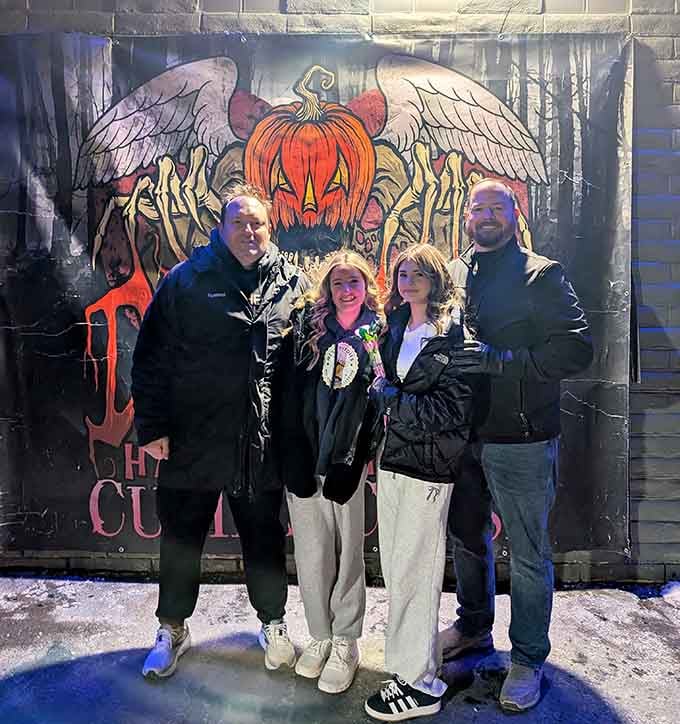 These brave souls are smiling now, but wait until they meet what's waiting inside those doors.