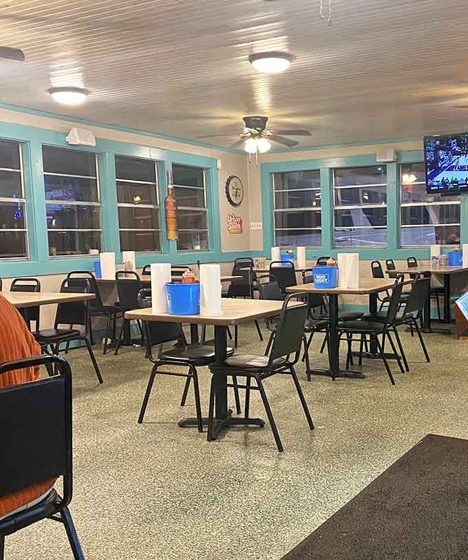Simple tables, turquoise trim, and ceiling fans create the perfect no-frills atmosphere for serious seafood eating.