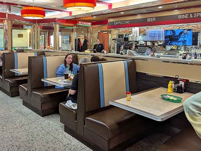 Classic diner booths where life's best conversations happen over coffee that never stops flowing and food that never disappoints.