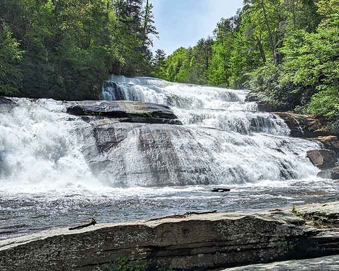 Water spreads wide like nature's own curtain call, gentle enough to approach yet powerful enough to mesmerize completely.