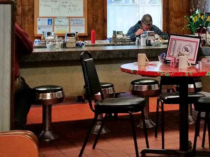 Wood paneling and orange floors create a time capsule vibe that somehow feels exactly right for great comfort food.