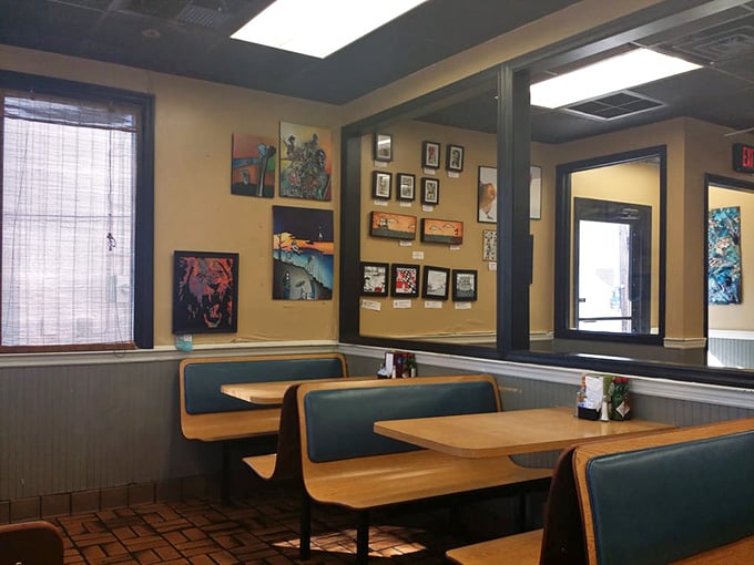 Classic diner booths where countless breakfast dreams have come true, surrounded by local art that gives the space character without trying too hard.