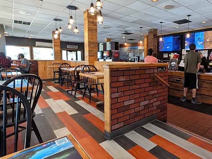 Wood, brick, and colorful floors create an atmosphere that's somehow both modern diner and cozy cabin rolled into one.