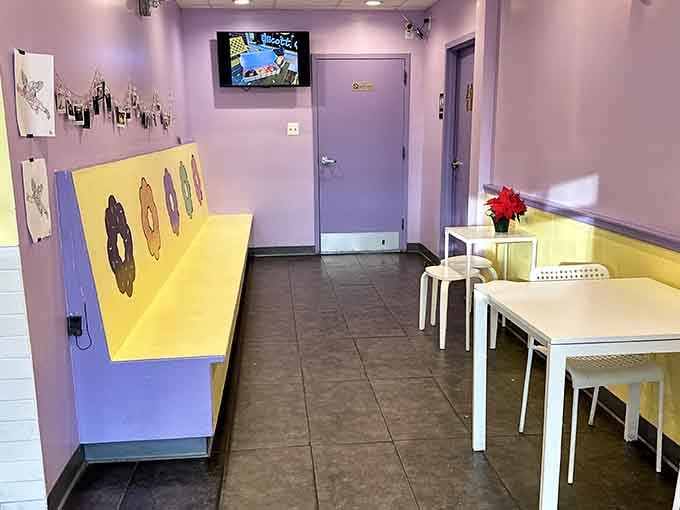 Purple walls and yellow accents create a space that's equal parts cheerful caf&eacute; and Instagram dream come true.