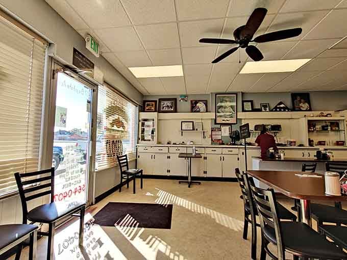 Simple booths, ceiling fans, and family photos create the kind of cozy atmosphere where magic happens on every plate.