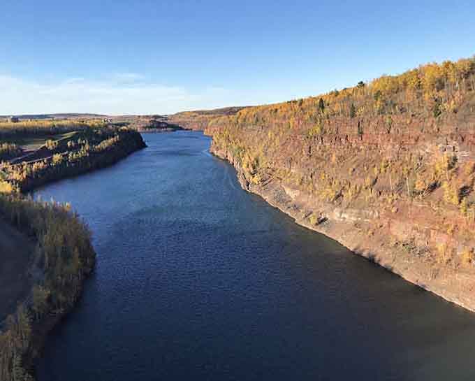 These iron-rich canyon walls glow like they've been painted, proof that industrial history can be breathtaking.