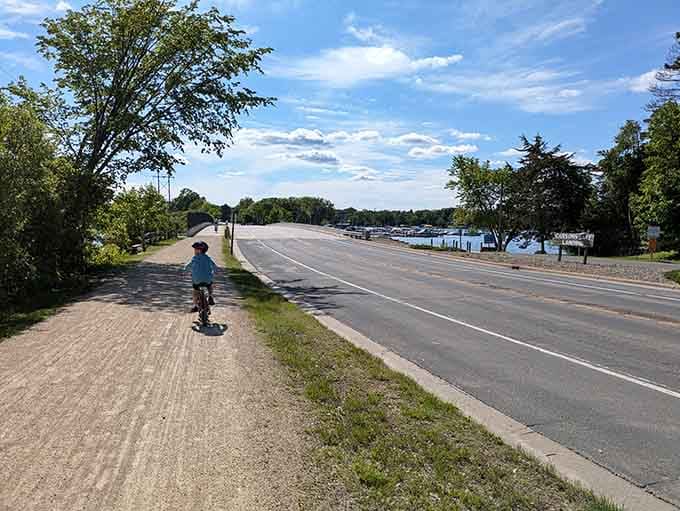 That lakeside path practically begs for a leisurely stroll, preferably with ice cream in hand and nowhere urgent to be.