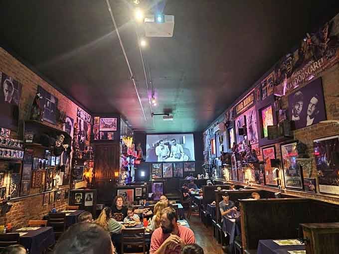 Every wall tells a story here, and classic monster films play while families dig into seriously good pizza.
