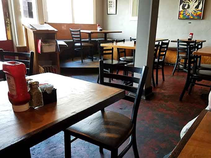 Wooden tables and padded chairs create the kind of comfortable setting where conversations flow as freely as the drinks.