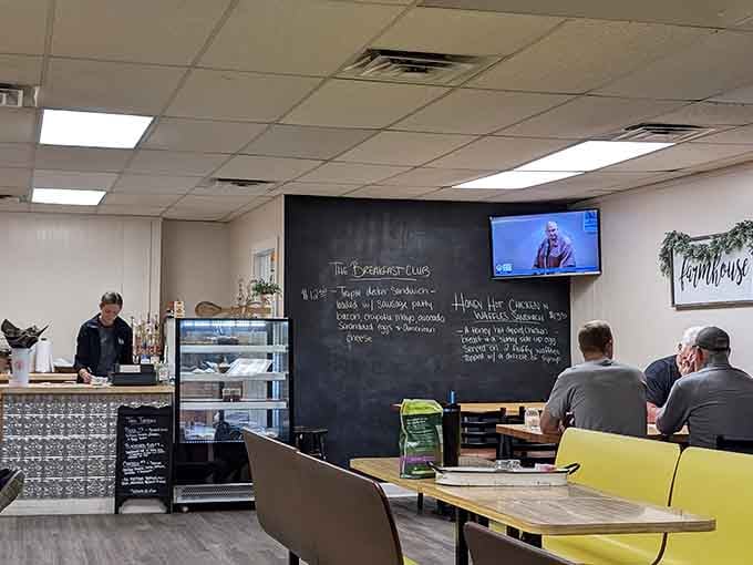 Bright yellow chairs and chalkboard specials create the perfect casual atmosphere for your morning meal ritual.