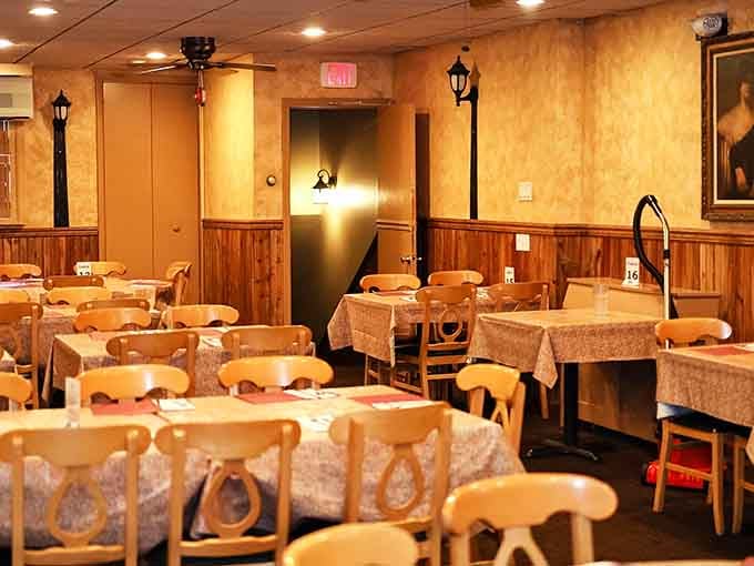 Wood paneling and warm lighting create the kind of atmosphere where families have been making memories since your grandparents were on first dates.