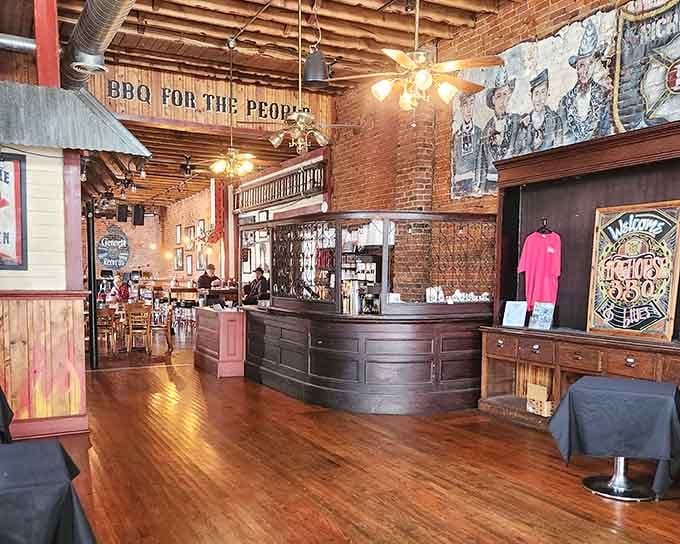Step inside and those exposed brick walls whisper stories while that "BBQ for the People" sign shouts delicious promises.
