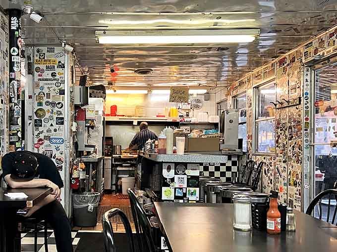 Every inch tells a story in this glorious chaos of stickers, memories, and pure diner soul.