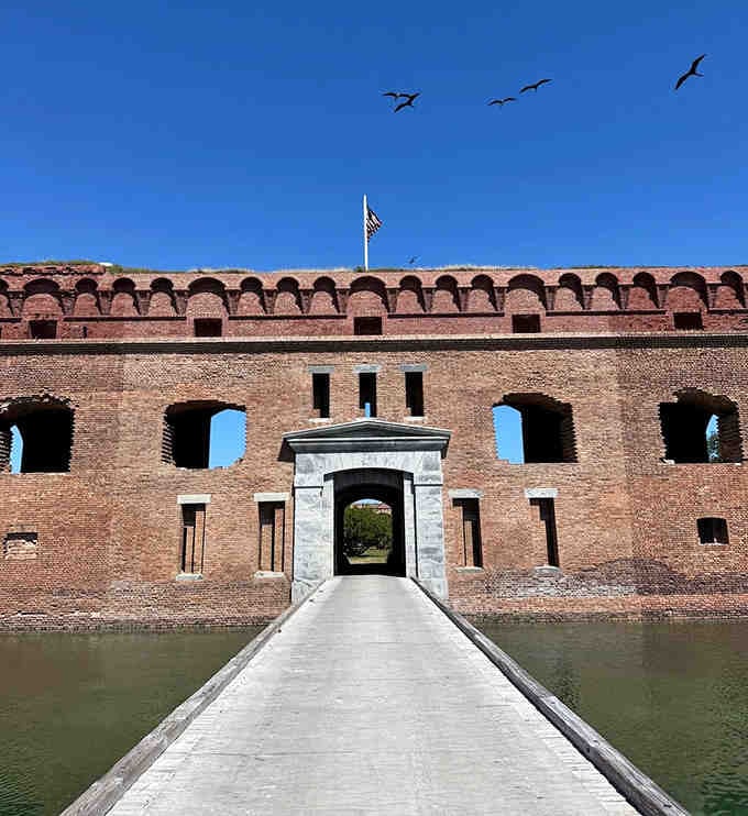 That entrance bridge stretches across the moat like a red carpet to history's most impressive brick achievement.